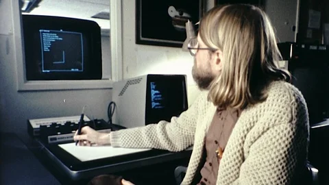 1980s Computer Programer Checks Writes C... | Stock Video | Pond5