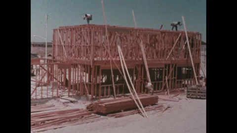 1980s: Construction site with wooden hou... | Stock Video | Pond5