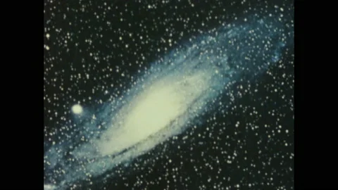 1980s: field of stars, picture of galaxy... | Stock Video | Pond5