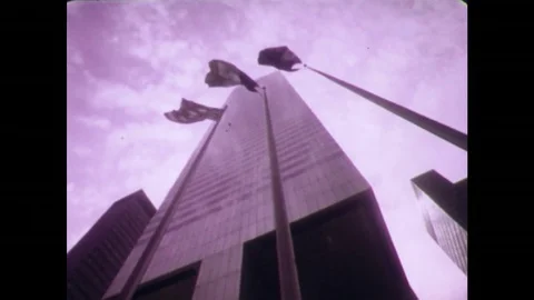 1980s: Flags Flying in Front of the City... | Stock Video | Pond5