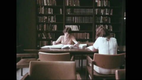 1980s: Girls at table in library. Studen... | Stock Video | Pond5