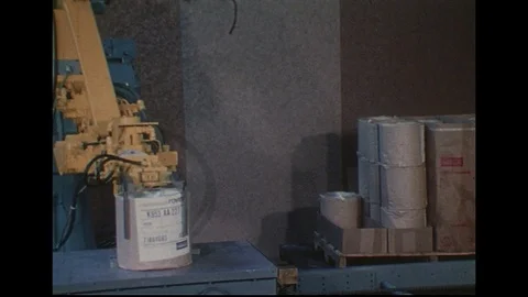 1980s: industrial robotic arm in a fact... | Stock Video | Pond5