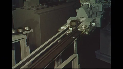 1980s: industrial robotic arm places pi... | Stock Video | Pond5