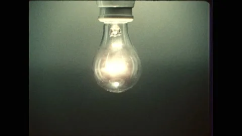1980s: light bulb comes on, glowing ligh... | Stock Video | Pond5