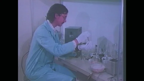 1980s: man with mustache in lab coat pou... | Stock Video | Pond5
