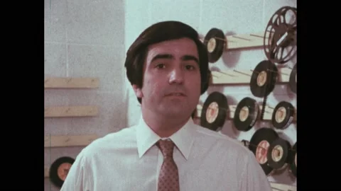 1980s: Man stands in editing room speaki... | Stock Video | Pond5
