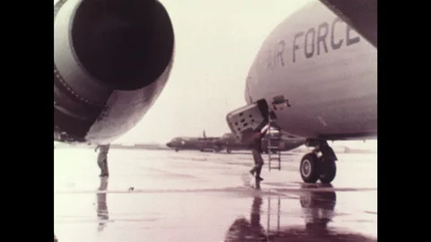 1980s: Man stands working on jet engine ... | Stock Video | Pond5