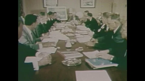 1980s: Men sit at conference table. Sci... | Stock Video | Pond5