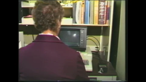 1980s: person sitting at computer then u... | Stock Video | Pond5