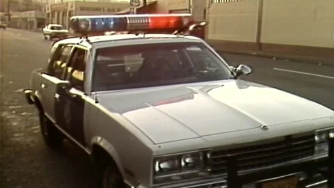 1980s POLICE OFFICER GETTING INTO COP CA... | Stock Video | Pond5