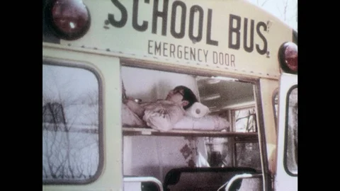 1980s: School bus, boy lies on wooden pl... | Stock Video | Pond5