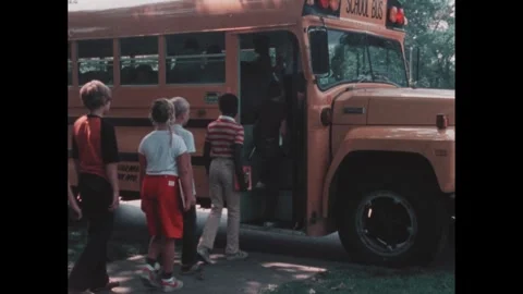 1980s: School bus drives through a city ... | Stock Video | Pond5