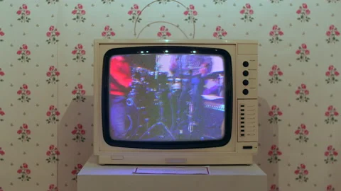 A 1980s white television set. The tv is ... | Stock Video | Pond5