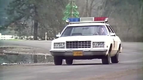 1984 OREGON STATE POLICE CAR DRIVING BY ... | Stock Video | Pond5