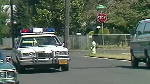 1984 POLICE CAR DRIVING ON RESIDENTIAL S... | Stock Video | Pond5