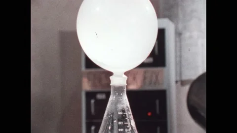 1990s: Balloon on top of flask inflates.... | Stock Video | Pond5