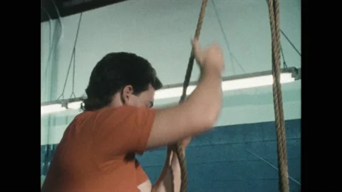 1990s: Boy pulling on rope through pulle... | Stock Video | Pond5