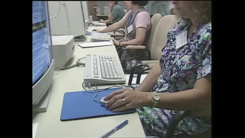 1990s: Computer lab, women sit, look at ... | Stock Video | Pond5