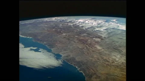 1990s: Satellite view of earth. Man in s... | Stock Video | Pond5