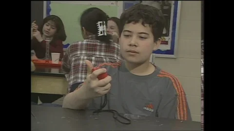 1990s: School science lab, boy uses stop... | Stock Video | Pond5