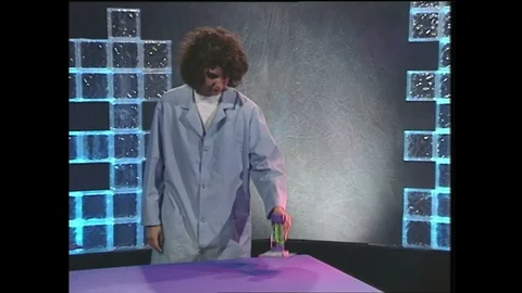 1990s: TV studio, women sets liquid cyli... | Stock Video | Pond5