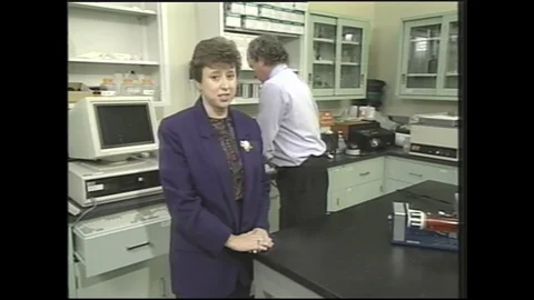 1990s: Woman stands in laboratory talkin... | Stock Video | Pond5