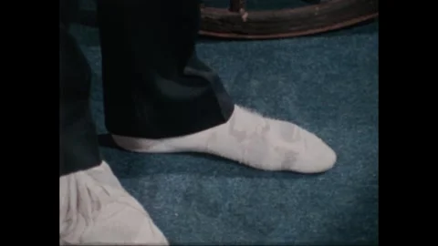 1990s: Zoom in on feet with missing shoe... | Stock Video | Pond5