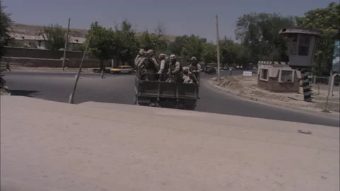 2000s Iraq Following Troops in Trucks th... | Stock Video | Pond5