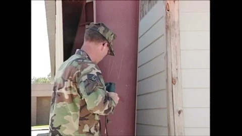 2000s: Soldier in camouflage uniform dri... | Stock Video | Pond5