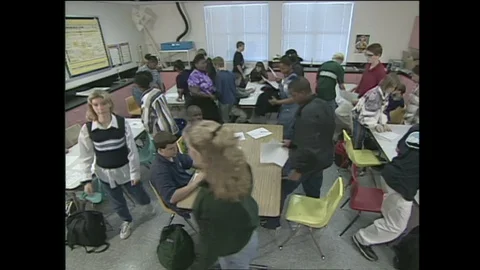 2000s: students stand up, walk around cl... | Stock Video | Pond5