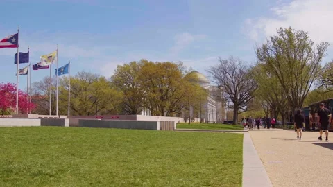 2023 - Flags adorn the lawn by the Natur... | Stock Video | Pond5