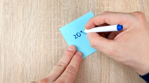 2025 writing in marker on a note sheet. ... | Stock Video | Pond5