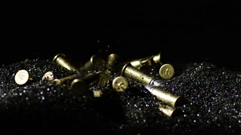 .22 Long Rifle Bullets Falling Into Bull... | Stock Video | Pond5