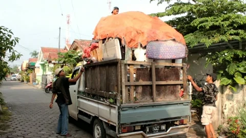 3 garbage men and their car in a housing... | Stock Video | Pond5