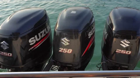 3 outboard engines attached to rear of s... | Stock Video | Pond5