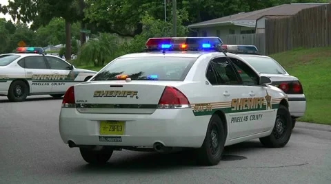 3 police cars blocking road | Stock Video | Pond5