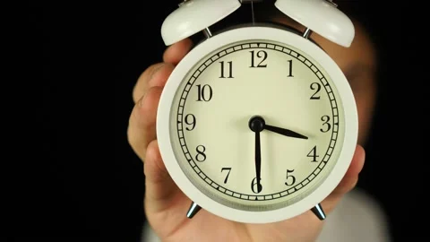 3:30 o'clock. Human hand holding alarm c... | Stock Video | Pond5