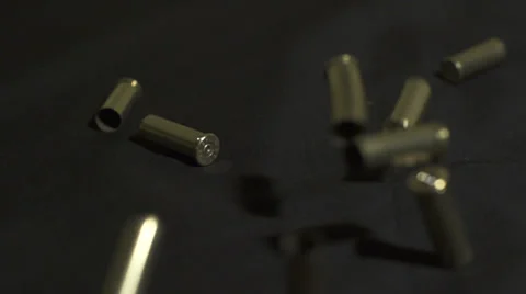 Bullet Shells Falling Stock Footage ~ Royalty Free Stock Videos | Pond5