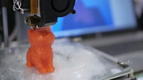 3d printer is printing orange plastic to... | Stock Video | Pond5