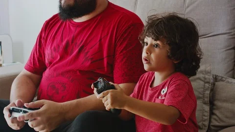 4 Year Old Boy Playing Video Game Togeth... | Stock Video | Pond5