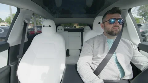 40s male driver inside Tesla Model Y car... | Stock Video | Pond5