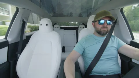 40s male driver inside Tesla Model Y car... | Stock Video | Pond5