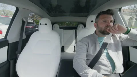 40s male driver inside Tesla Model Y car... | Stock Video | Pond5