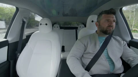 40s male driver inside Tesla Model Y car... | Stock Video | Pond5
