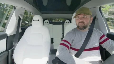 40s male driver inside Tesla Model Y car... | Stock Video | Pond5