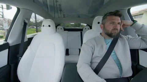 40s male driver inside Tesla Model Y car... | Stock Video | Pond5