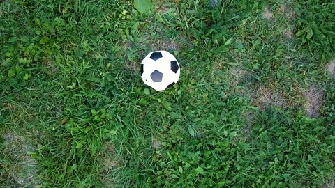 4k aerial: Flight over football ball lyi... | Stock Video | Pond5