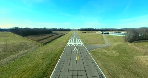 4K Aerial Low Pass Over Airport Runway O... | Stock Video | Pond5