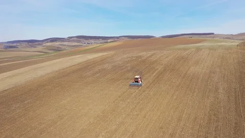 4k Aerial top view of a tractor, combine... | Stock Video | Pond5