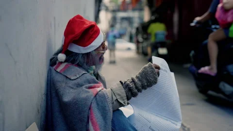 4K, Asian homeless old man read a newspa... | Stock Video | Pond5